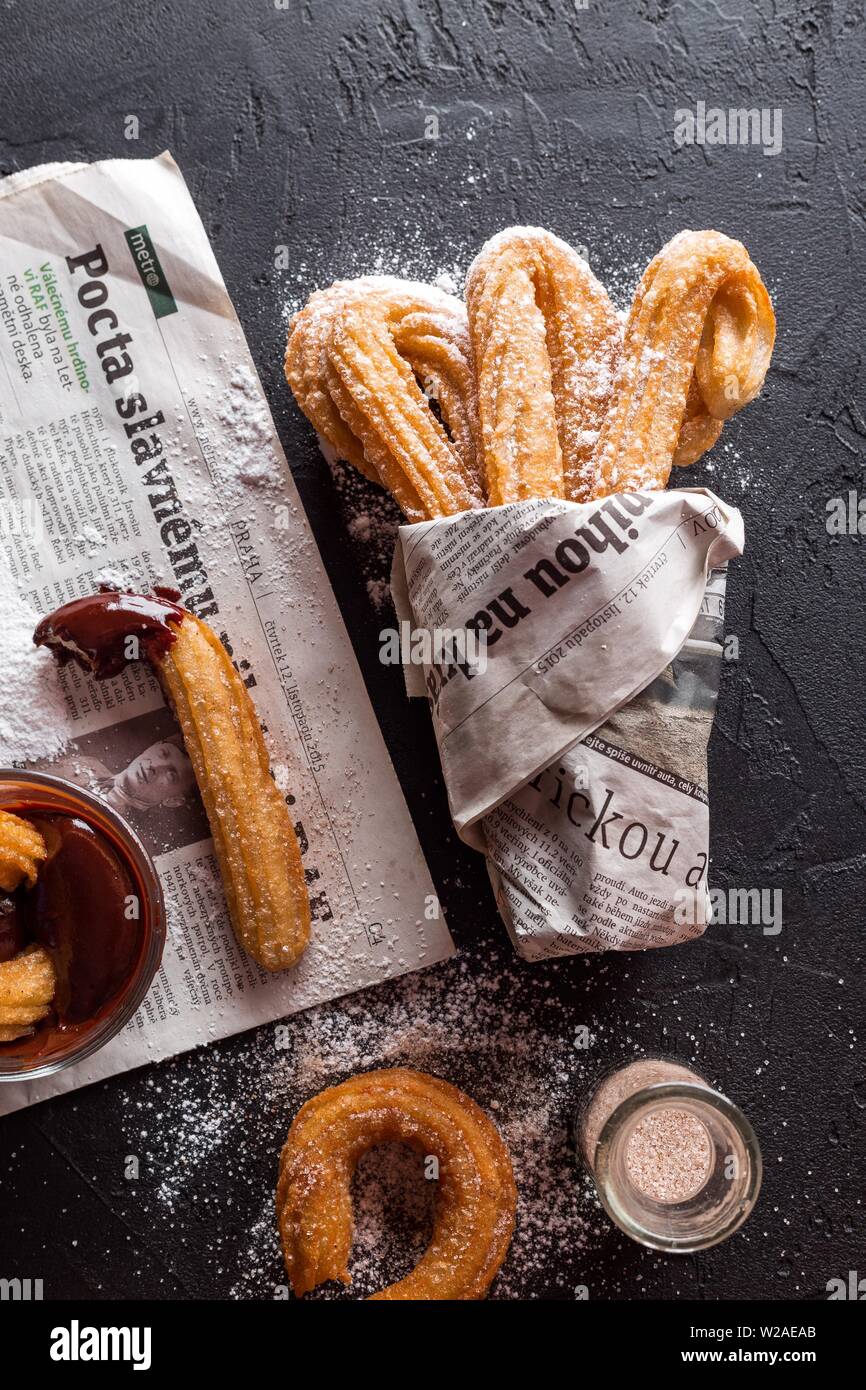 Churros sticks fresh hot in paper Stock Photo - Alamy