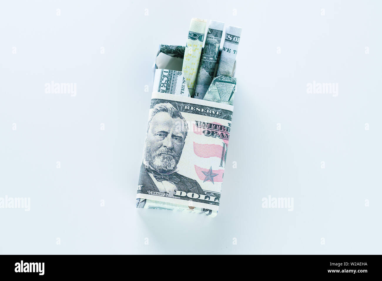 Package of cigarette filled with paper money dollars banknote instead ...