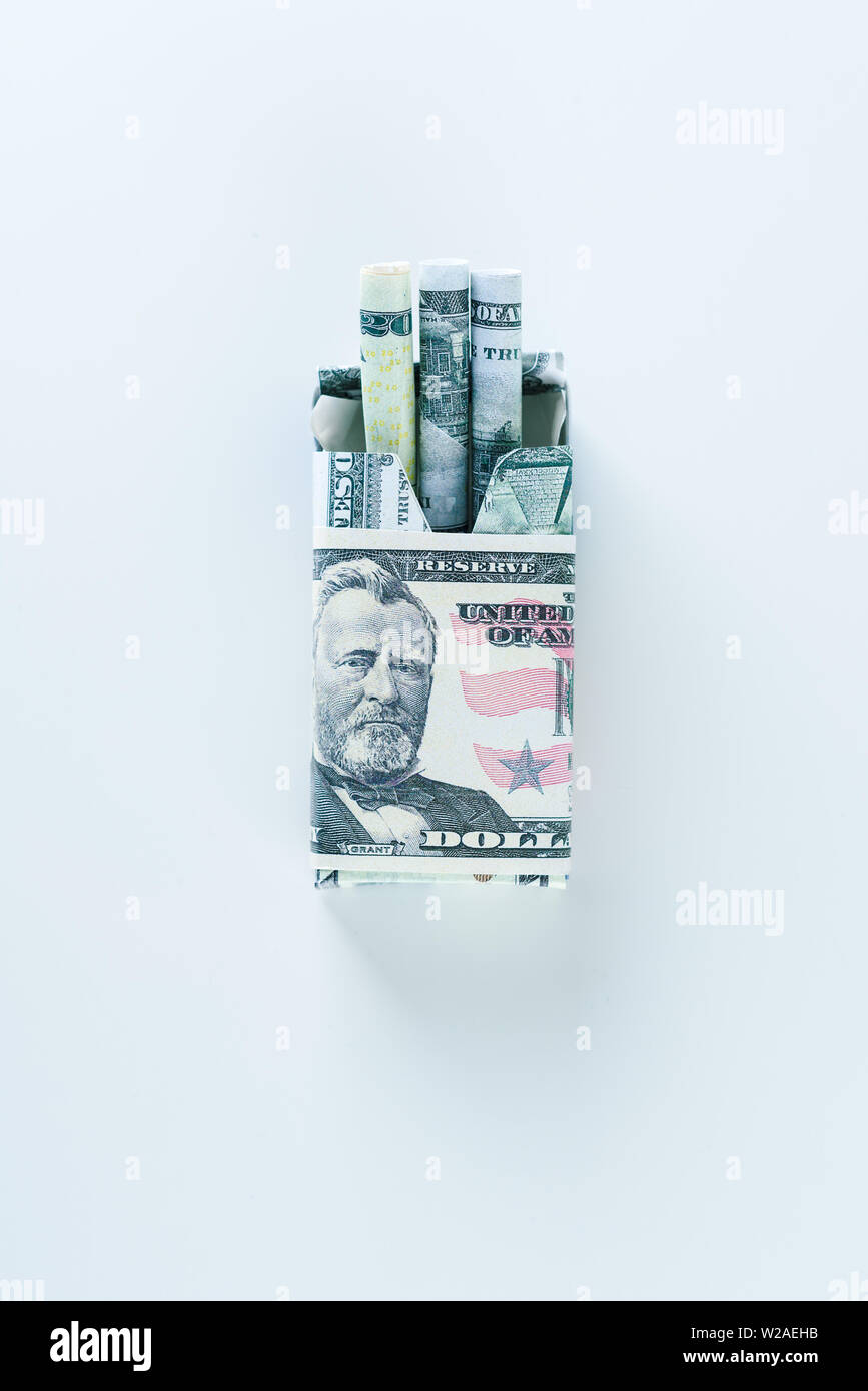 Package of cigarette filled with paper money dollars banknote instead ...