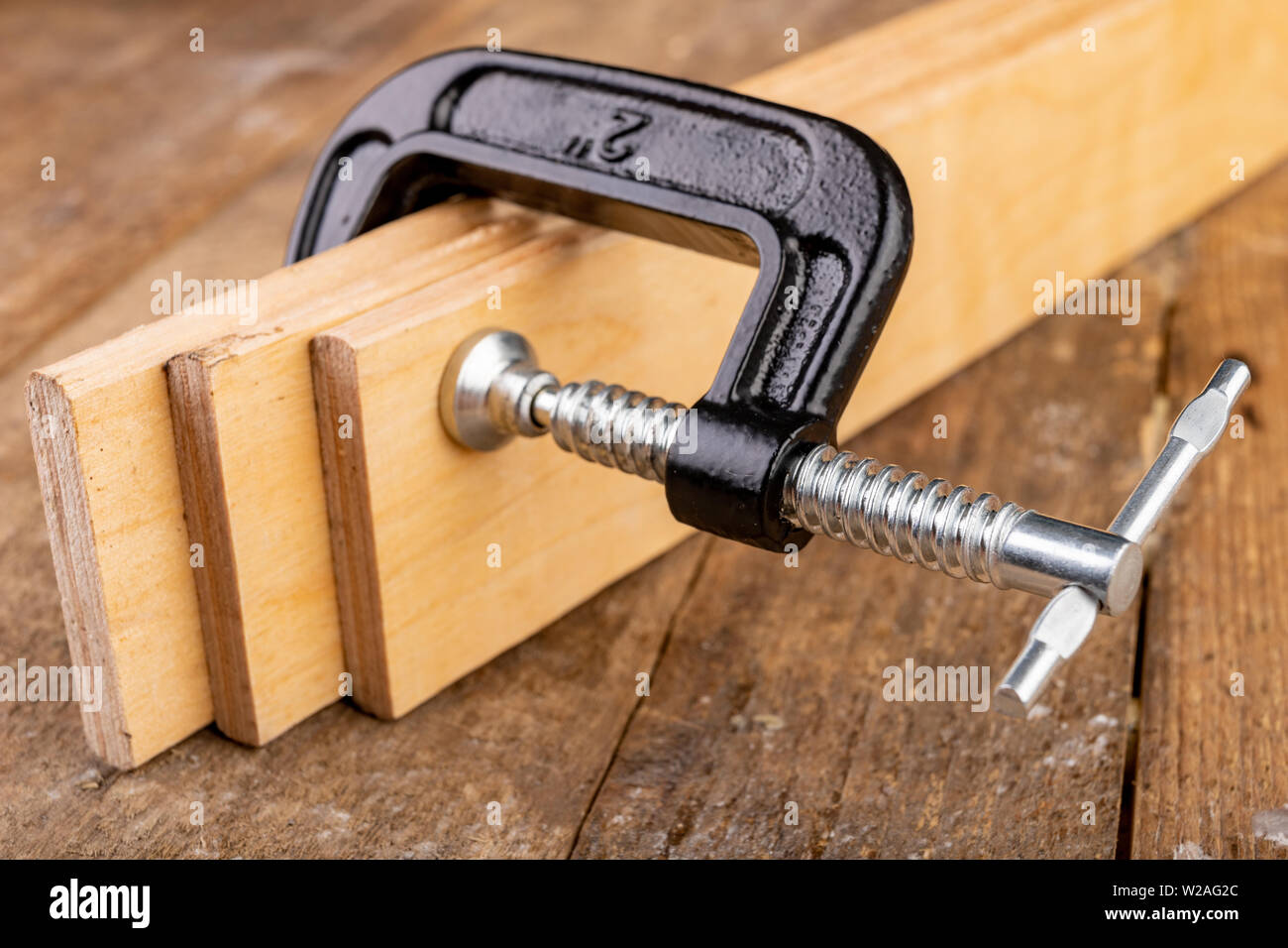 A small joinery clamp used for gluing planks. Accessories for ...
