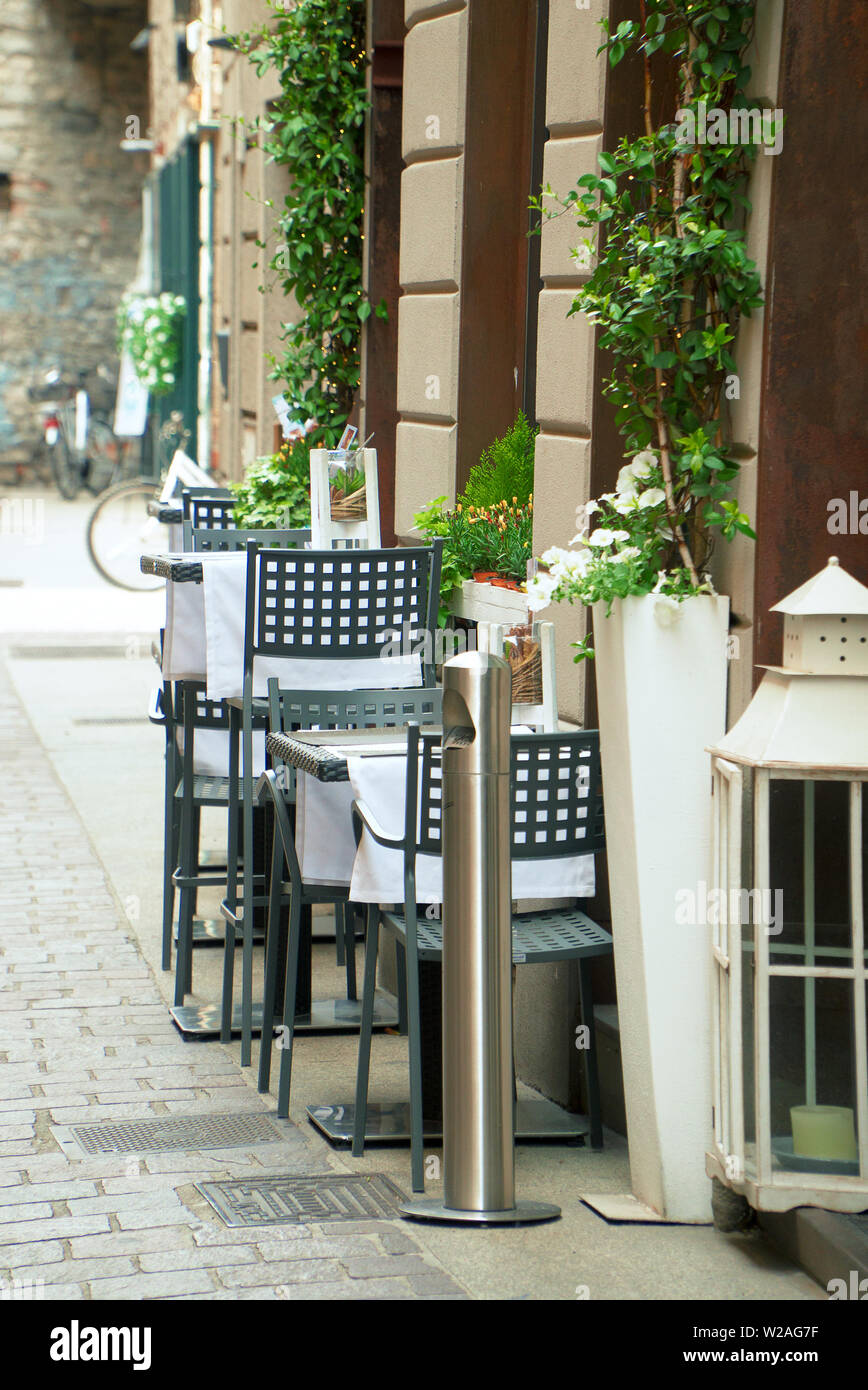 Outdoor cafe terrace exterior with chairs and tables Stock Photo - Alamy