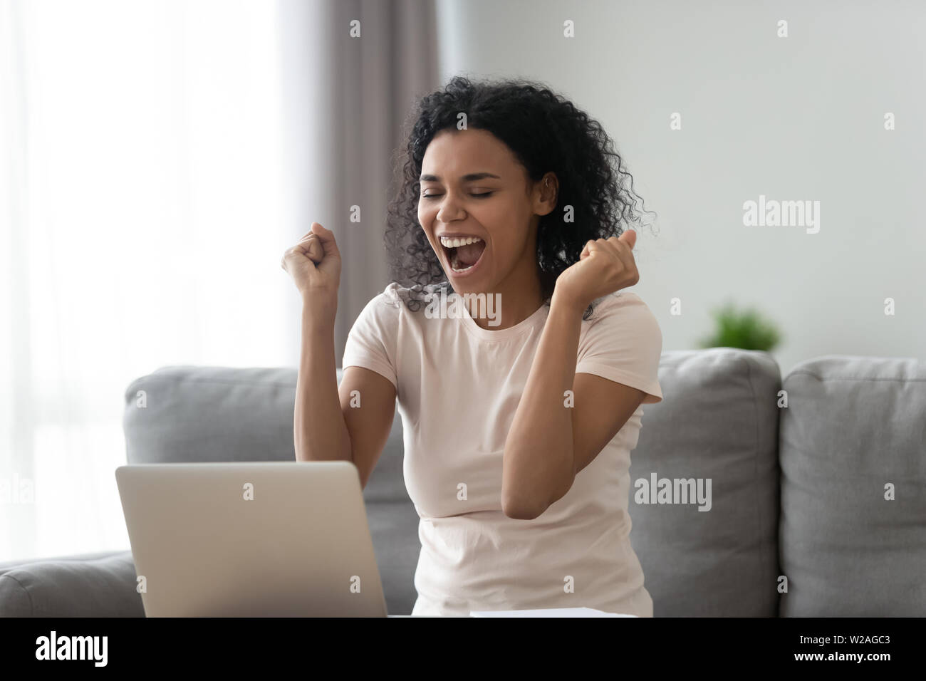 Overjoyed excited african american student hi-res stock photography and ...