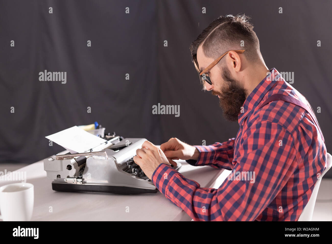 people, writer and hipster concept - young stylish writer working on ...