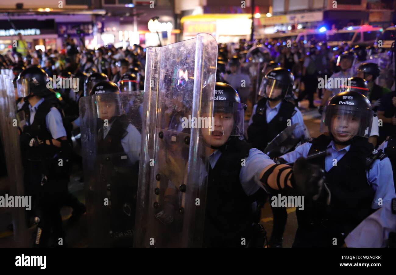 Hong Kong, China. 7th July, 2019. Riot Police with shields advance on ...