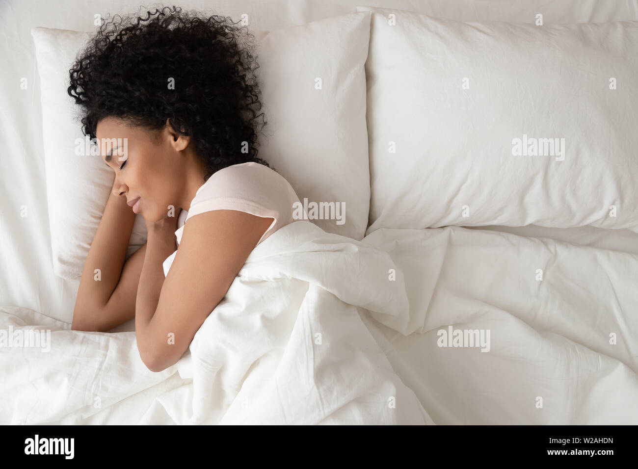 Woman bed overhead alone hi-res stock photography and images - Alamy