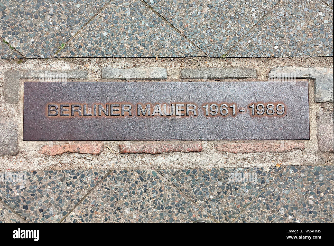 Marking the course of the Berlin Wall at Potsdamer Platz in Berlin ...