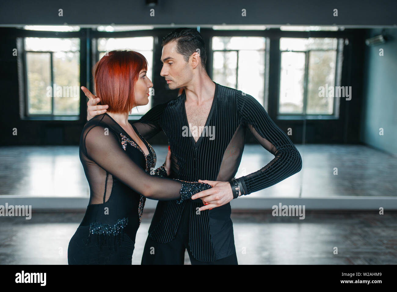 Man and woman on ballrom dance training in class. Female and male ...