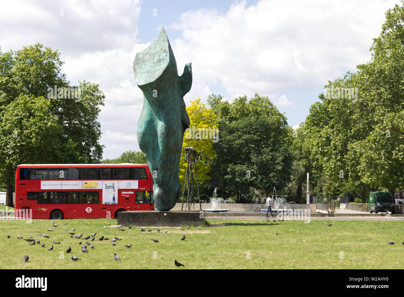 Still Water statue and a London bus in London England Stock Photo - Alamy