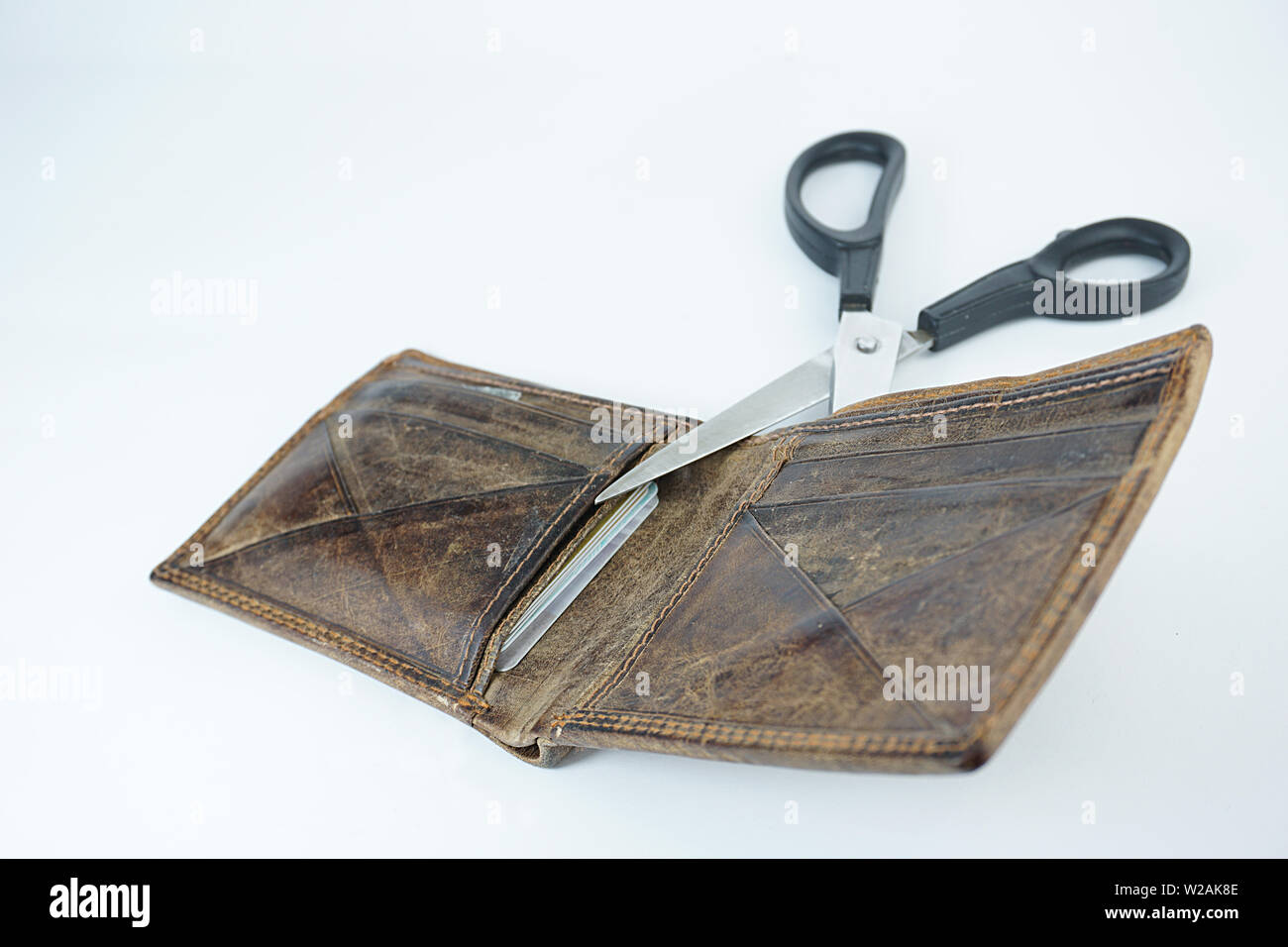 Scissors cutting wallet pencil isolated on white background Stock Photo ...