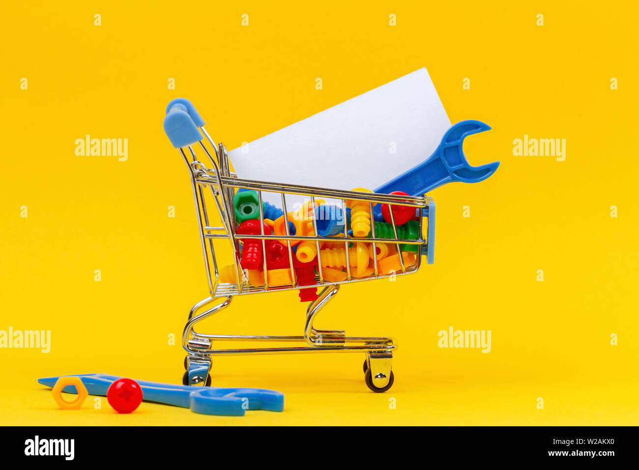 Shopping trolley cart with blue wrenches tools and full of colorful ...