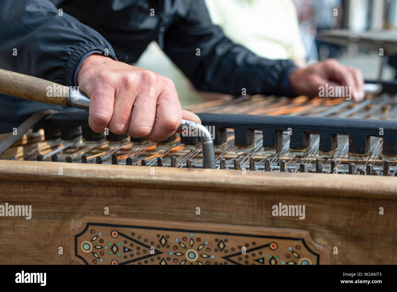 Tuning an old instrument, dulcimer Stock Photo - Alamy