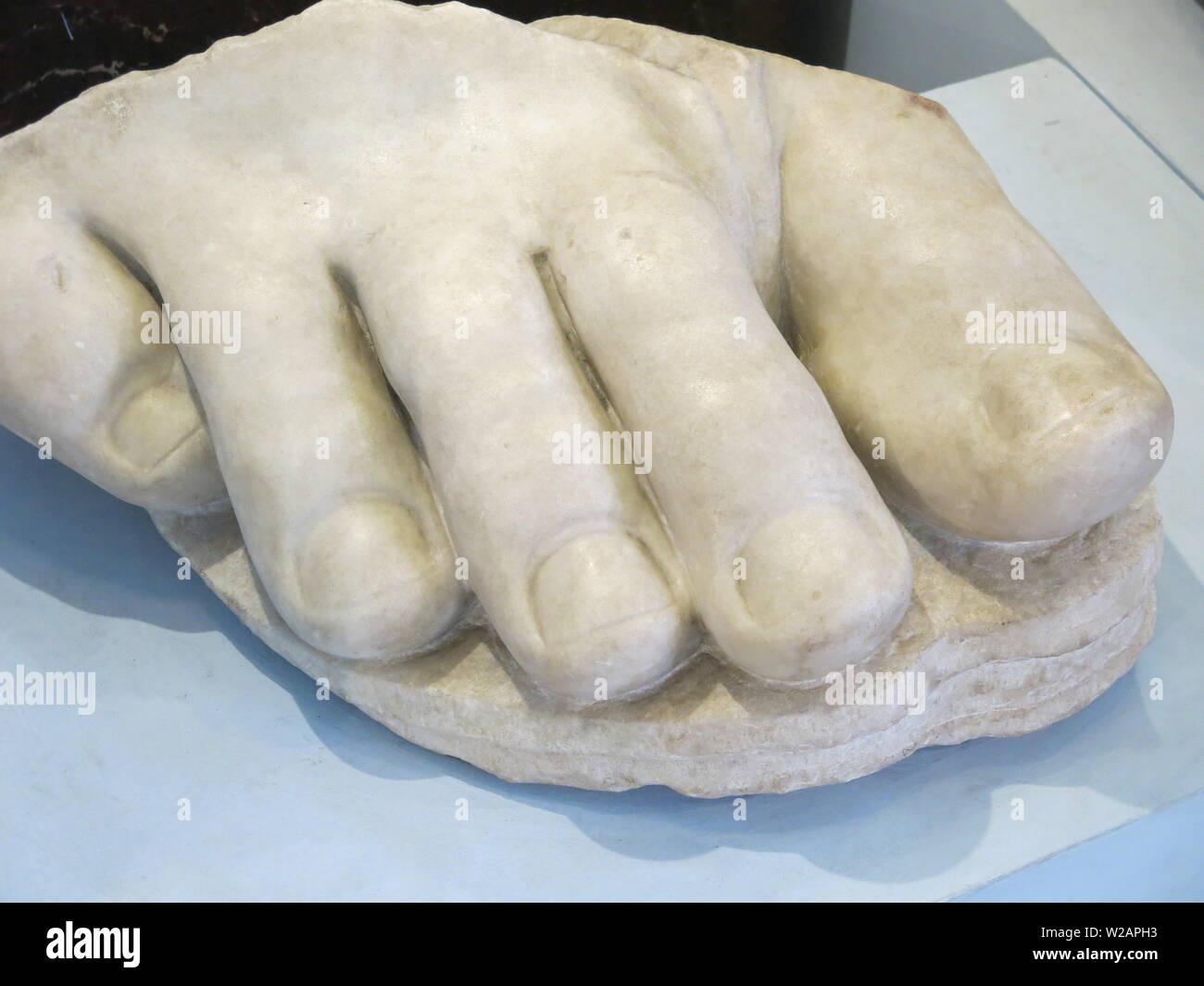 Close-up of a foot sculpted in marble from the Ancient Rome excavations ...