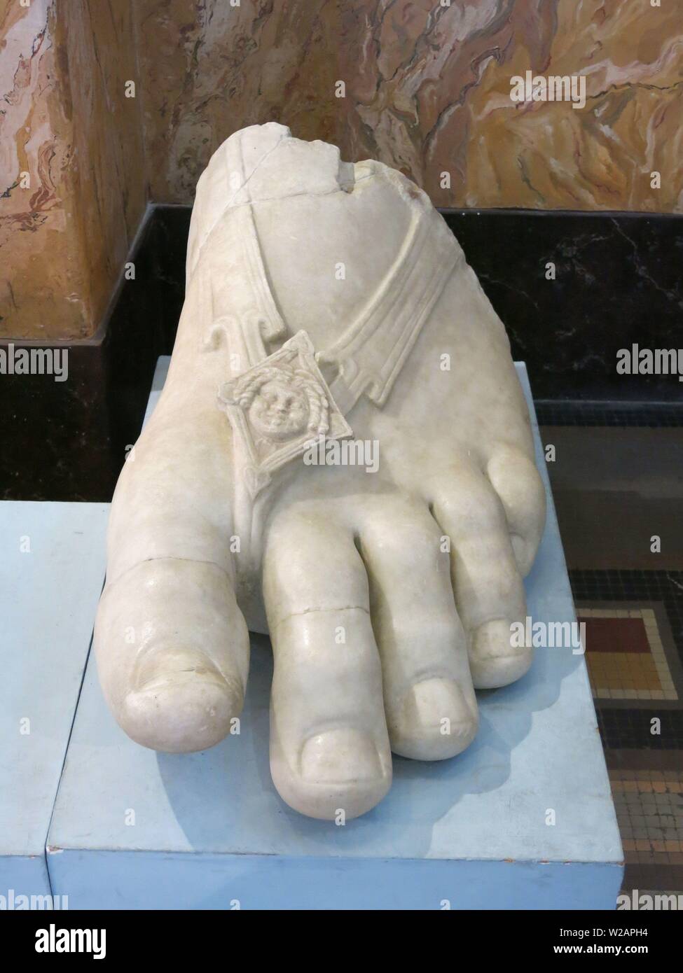 Close-up of a foot sculpted in marble from the Ancient Rome excavations ...