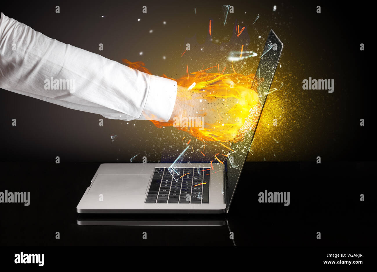 Firing hand hitting strongly laptop screen glass Stock Photo - Alamy