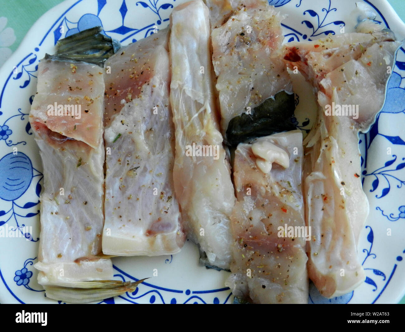 fresh cut fish cooked in the plate for further preparation Stock Photo ...