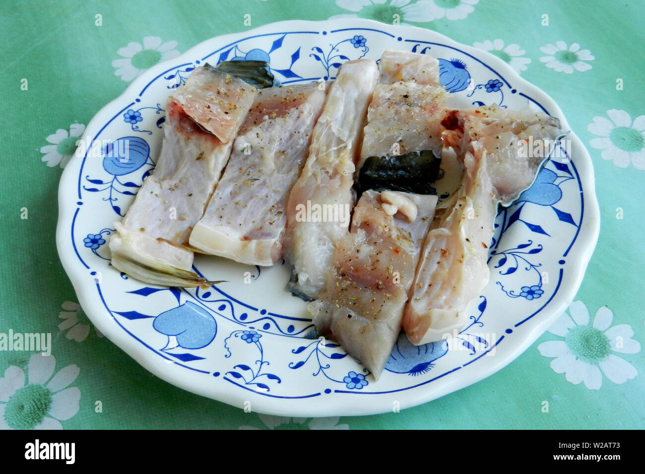 fresh cut fish cooked in the plate for further preparation Stock Photo ...