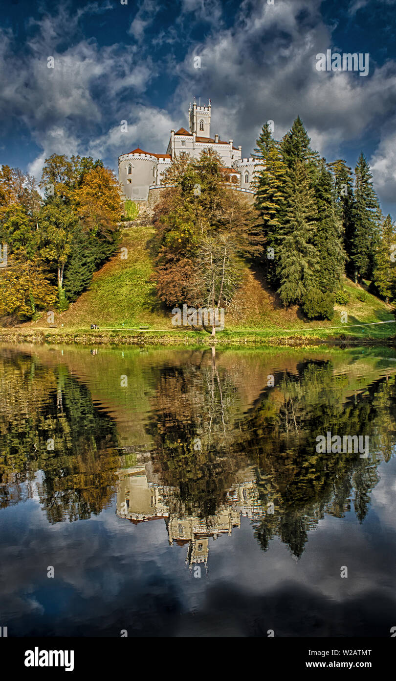 Medieval castle and lake reflection of Trakoscan, Croatia. Castle is ...