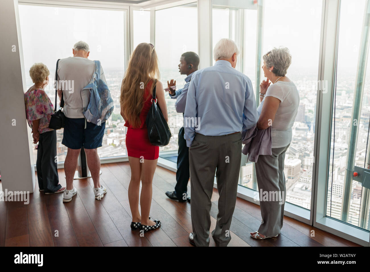 LONDON ENGLAND July 16 2013; Group of people standing on an upper level ...
