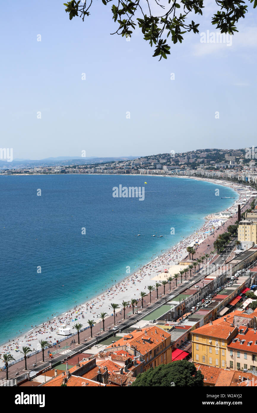 Blue bay, white beach and orange roofs viewed from Colline du Château ...