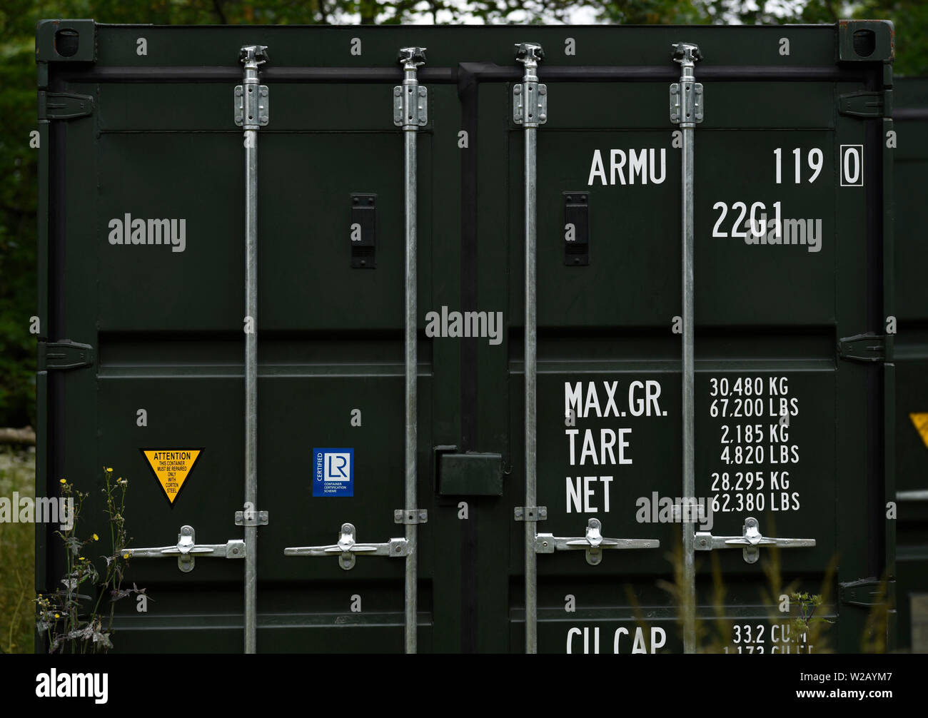 An international shipping container showing it's weight, maximum cargo ...