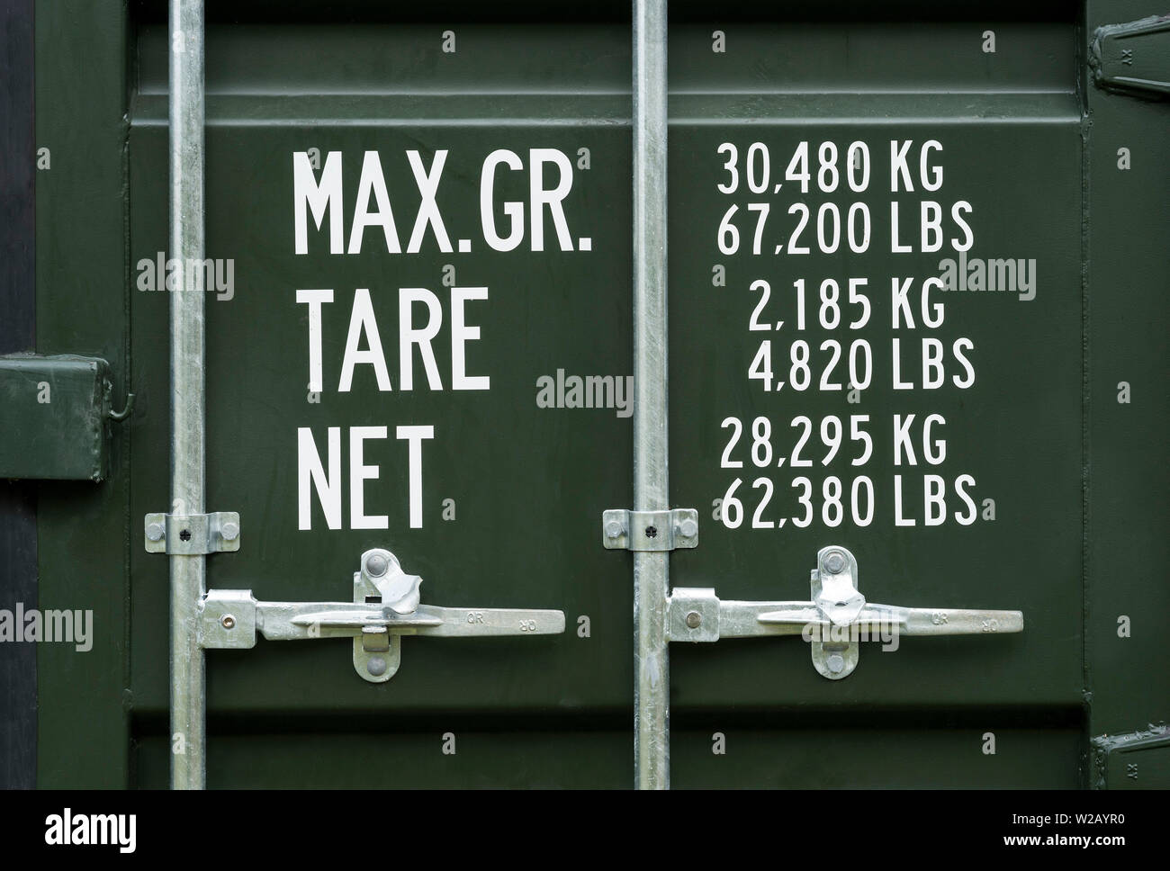 An international shipping container showing it's weight, maximum cargo ...