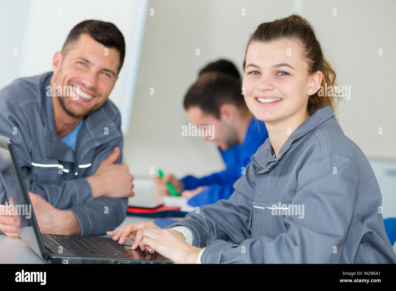 happy smiling technical with female student Stock Photo - Alamy