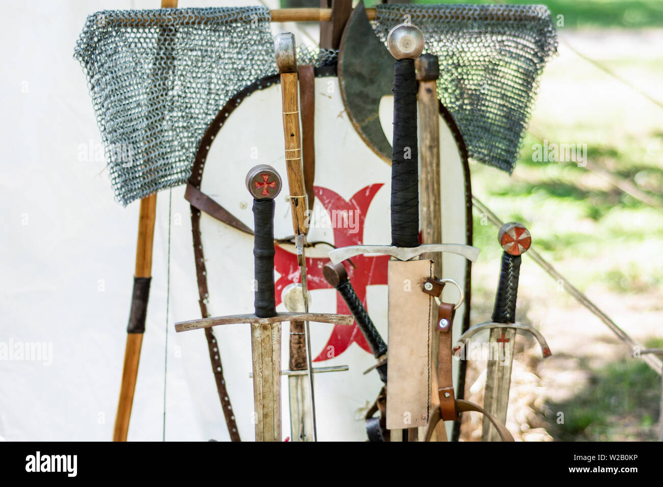 A medieval old group of swords and knights equipment. Close up of ...
