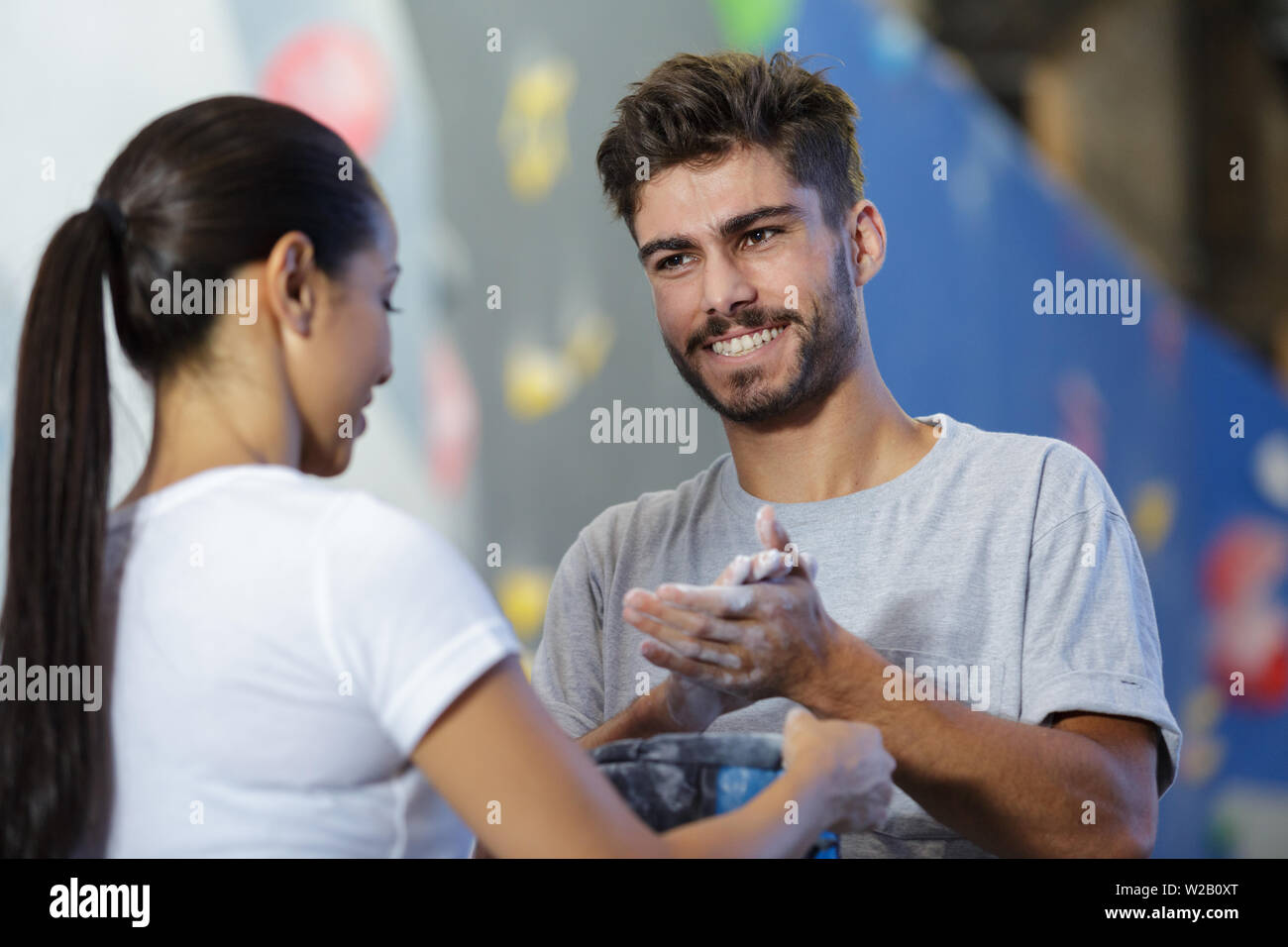 man and woman chalking hand Stock Photo - Alamy