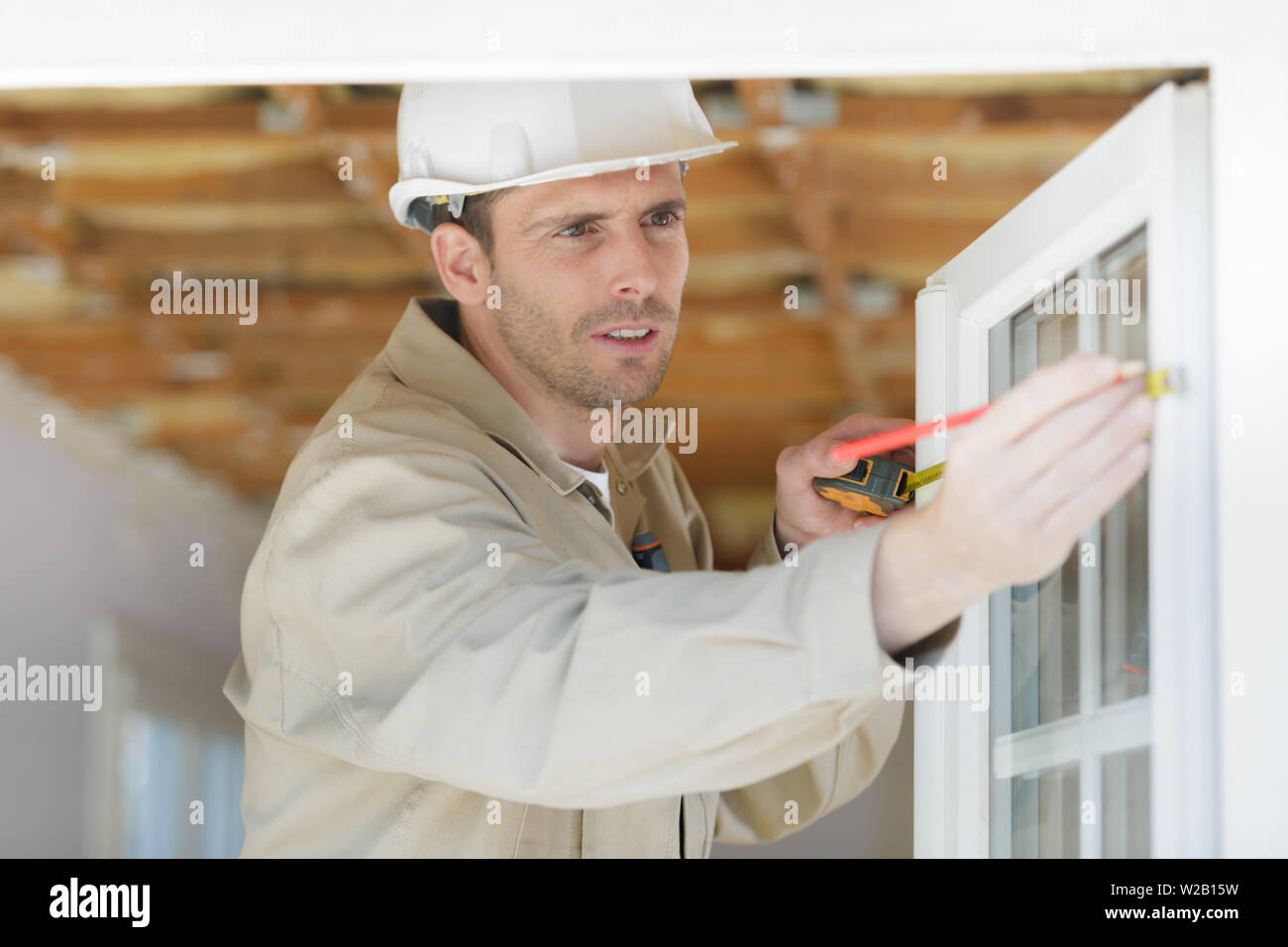Worker installing double glazing hi-res stock photography and images ...
