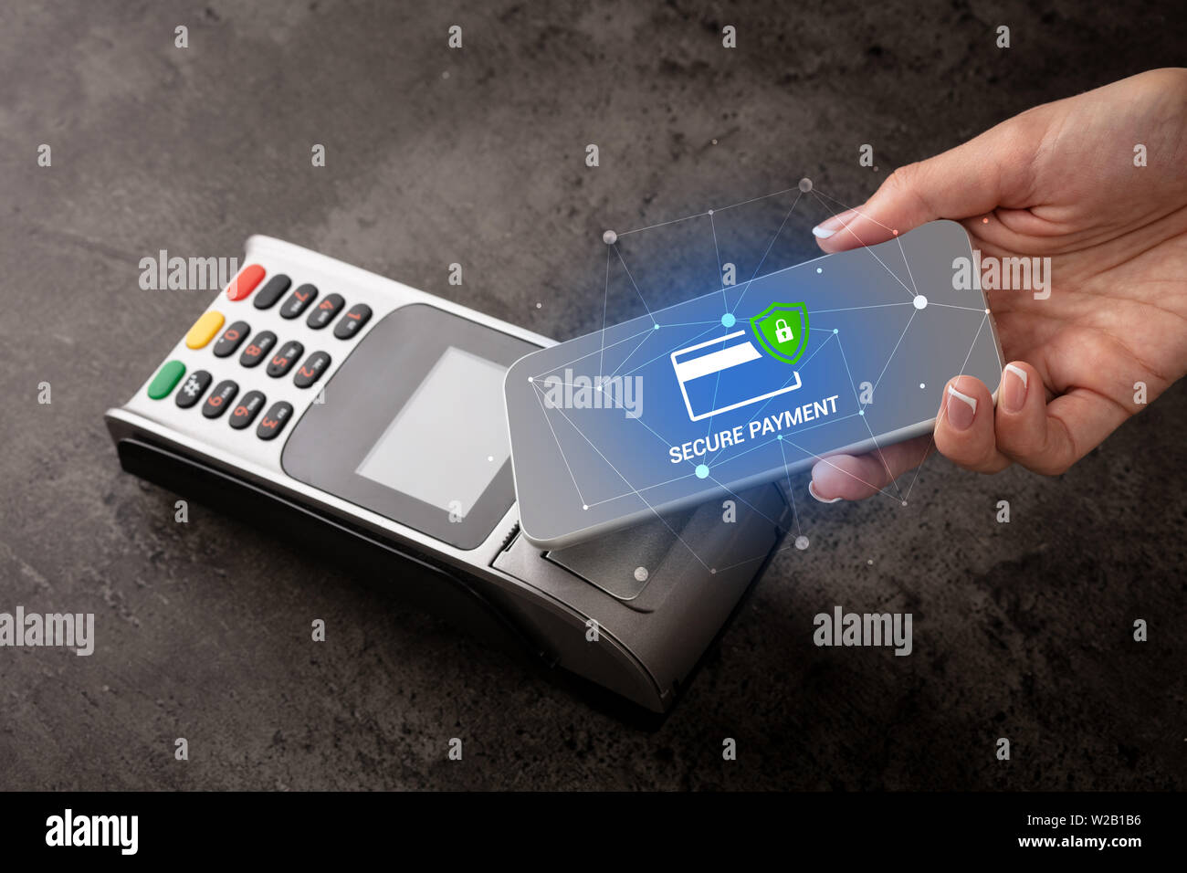 Hand paying on terminal with smartphone in secure payment system Stock ...