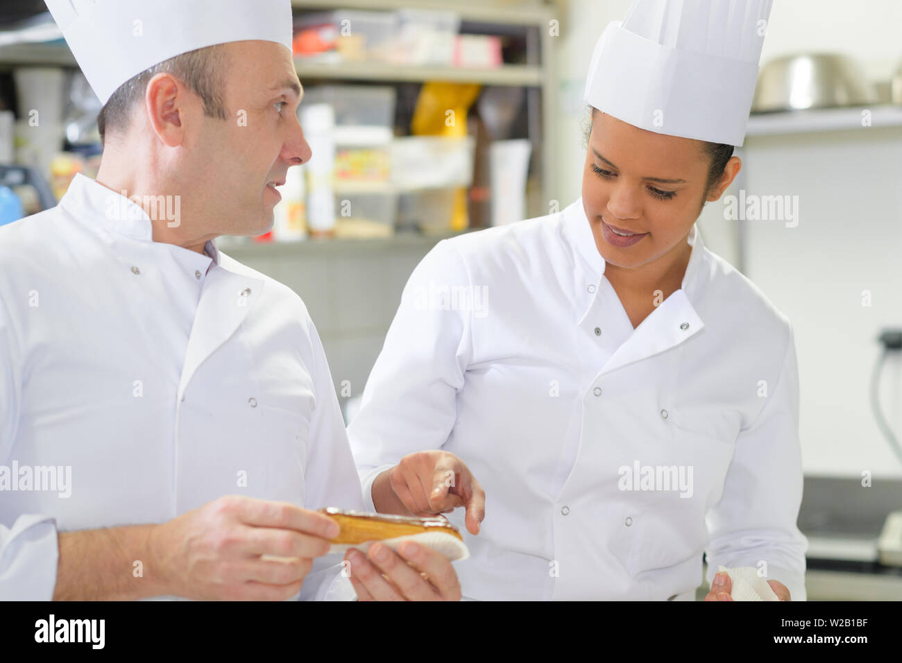 female apprentice pastry cook Stock Photo - Alamy