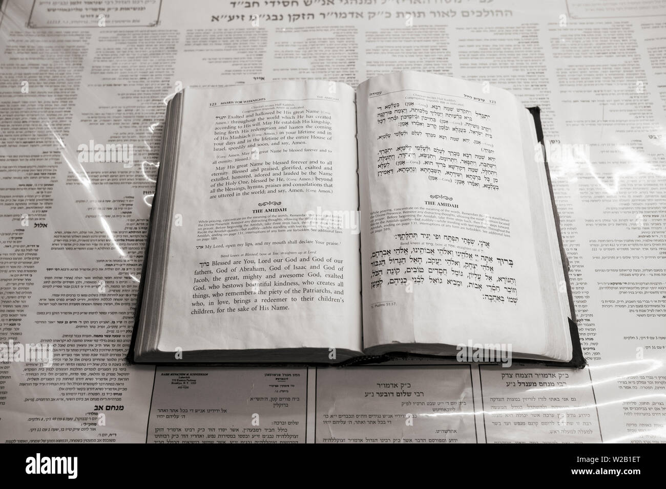 A Hebrew English prayer book (siddur) open to the evening's Amidah ...
