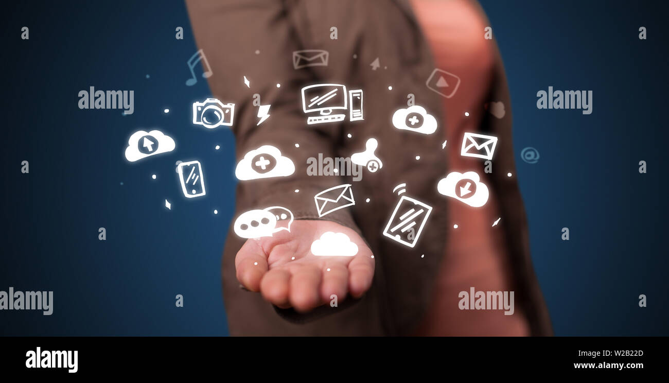Hand holding application icons and symbols in her hand Stock Photo - Alamy