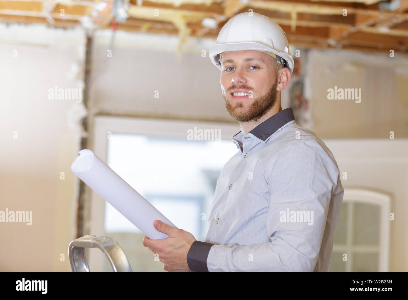 male architect inside a residential property under renovation Stock ...