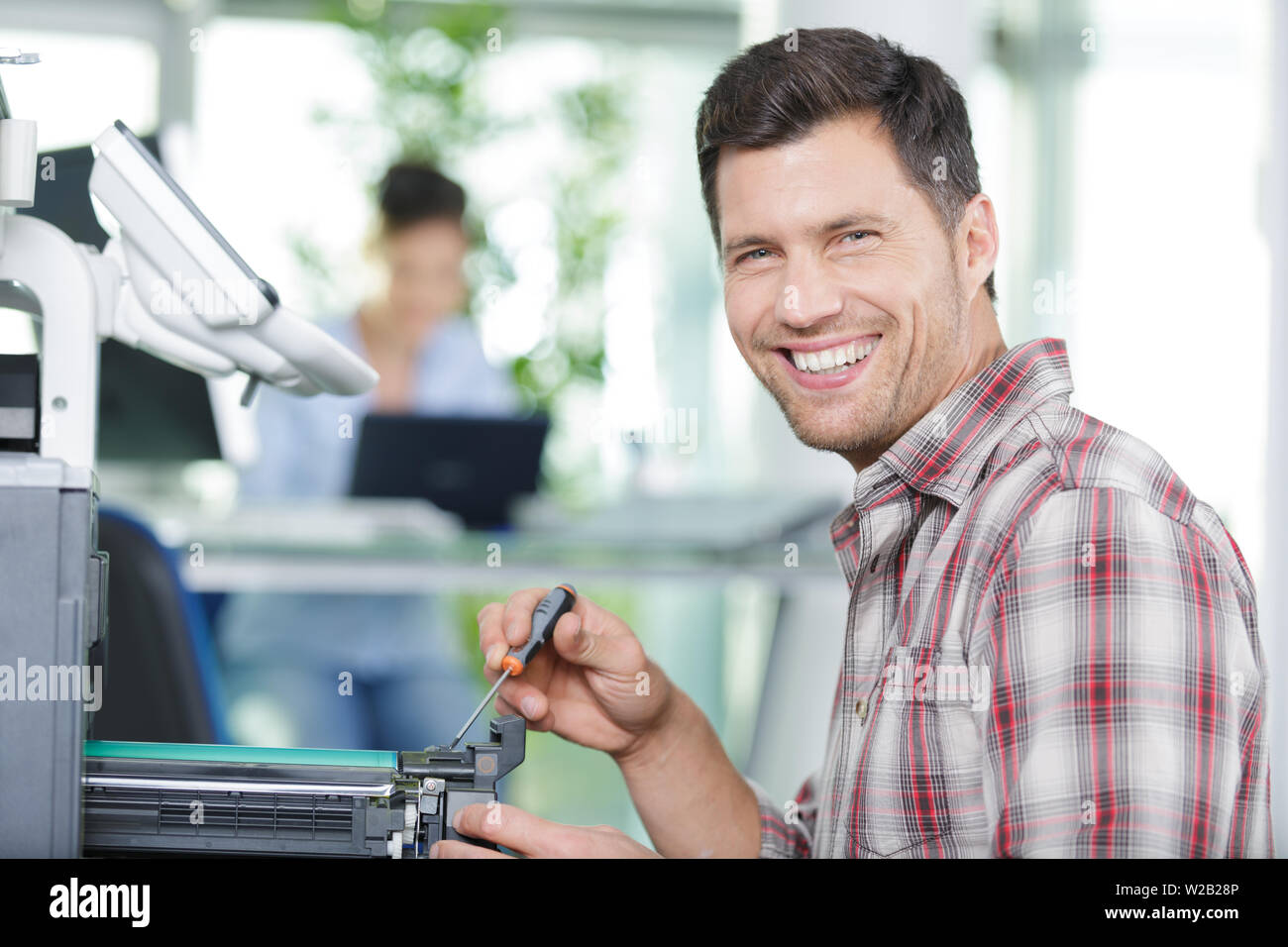 Man fixing ink jet hi-res stock photography and images - Alamy