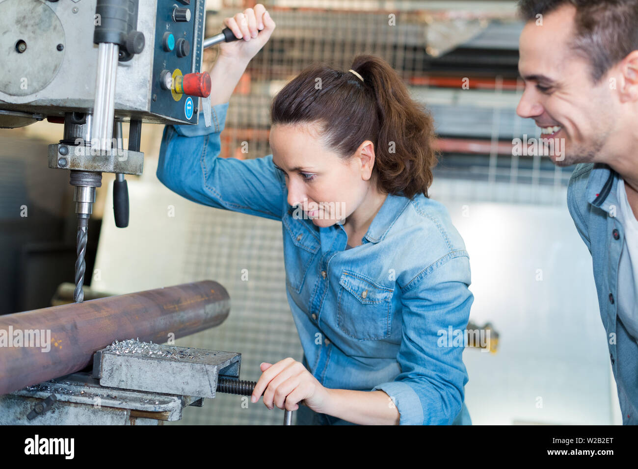 Woman man tools drill hi-res stock photography and images - Alamy