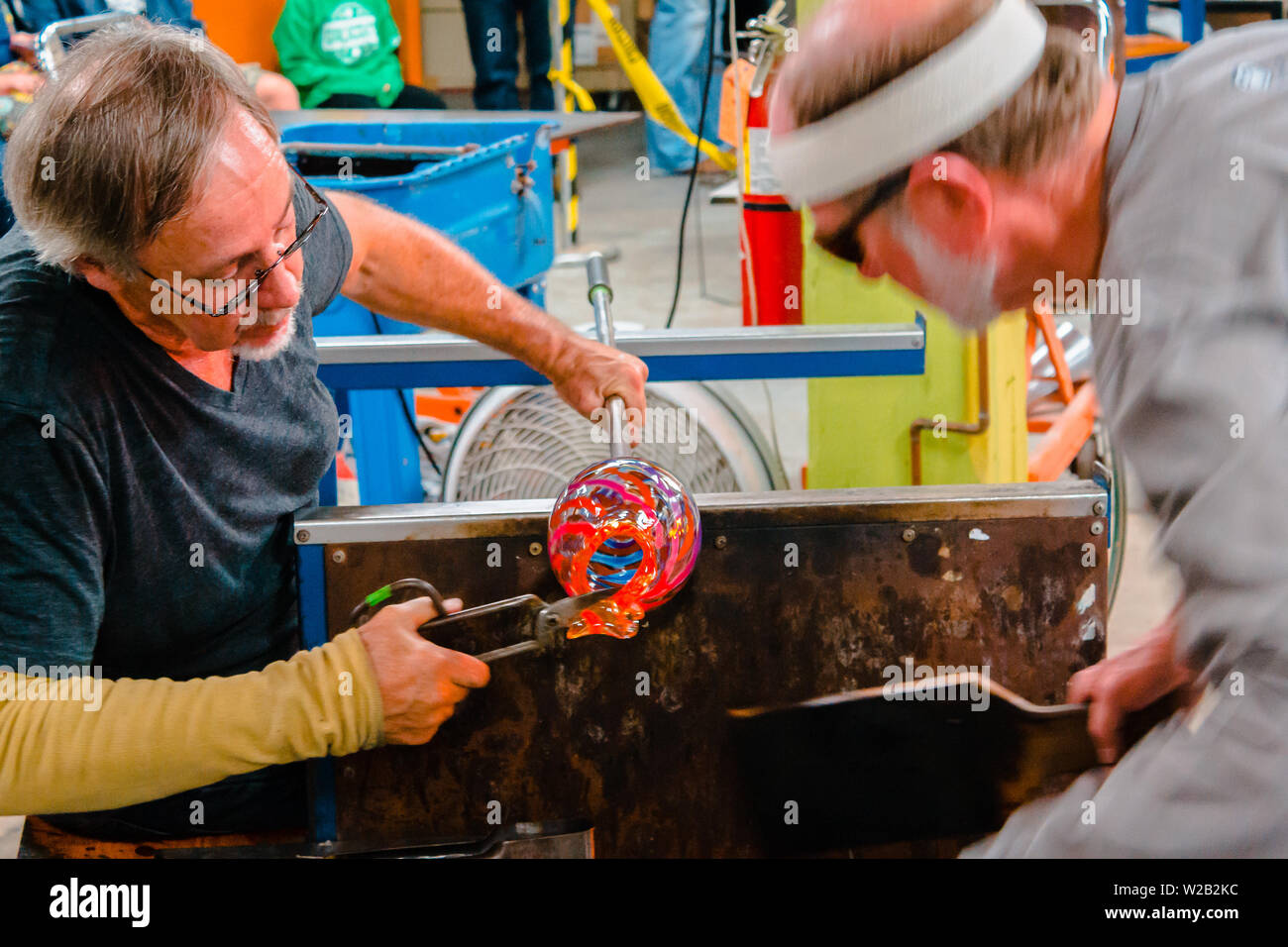 Artisans creating and shaping glass bowls and dishes Stock Photo - Alamy