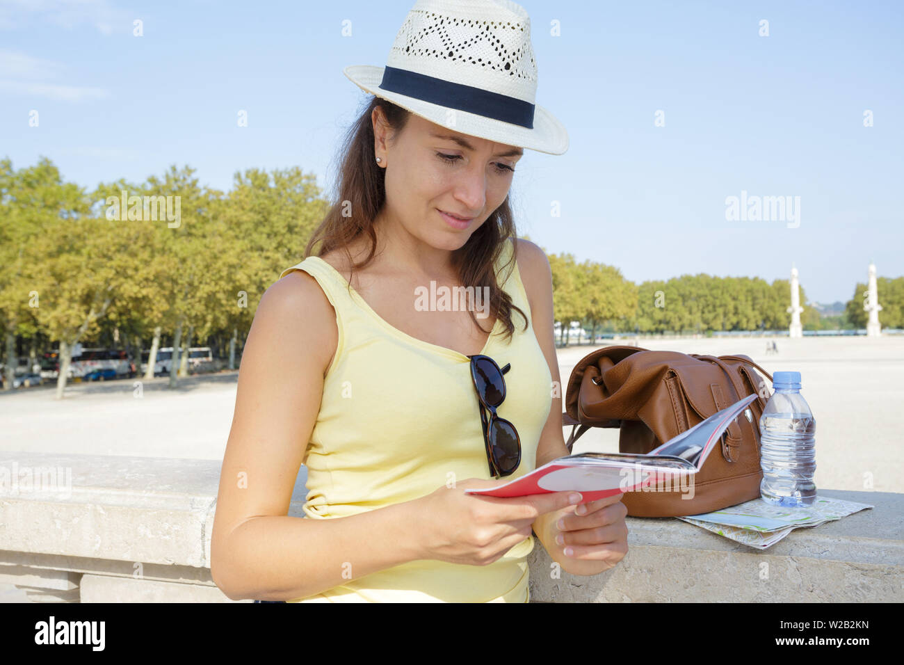 Happy tourist checking paper hi-res stock photography and images - Alamy