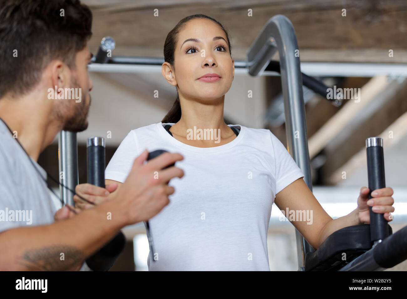 woman working out in the gym coach Stock Photo - Alamy