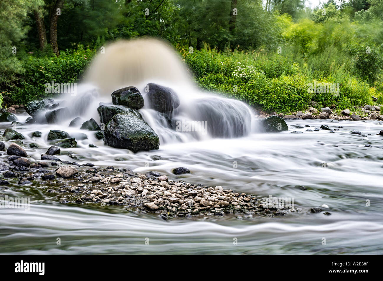 mixing zone of sewage discharge of urban sewage. river pollution. city ...