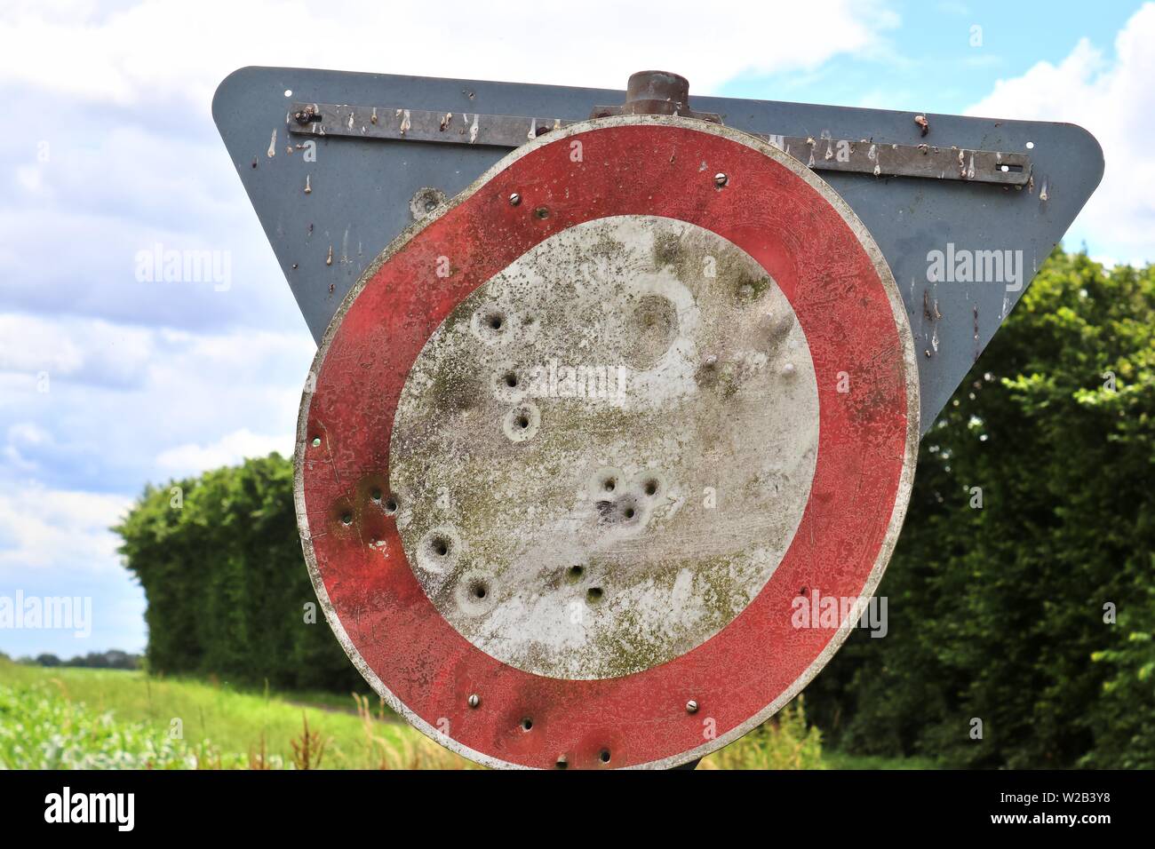 Close up view at multiple bullet holes in a german traffic sign on a ...