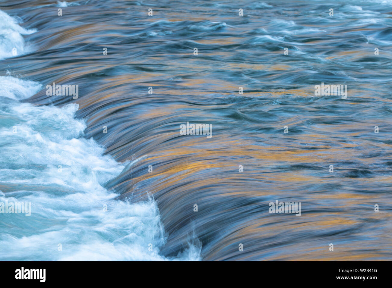 Water concept - river water flowing with light reflecting of its ...