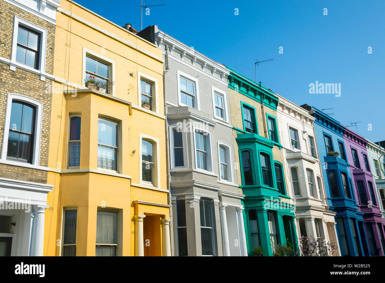 Traditional colorful row houses in the Notting Hill neighborhood of ...