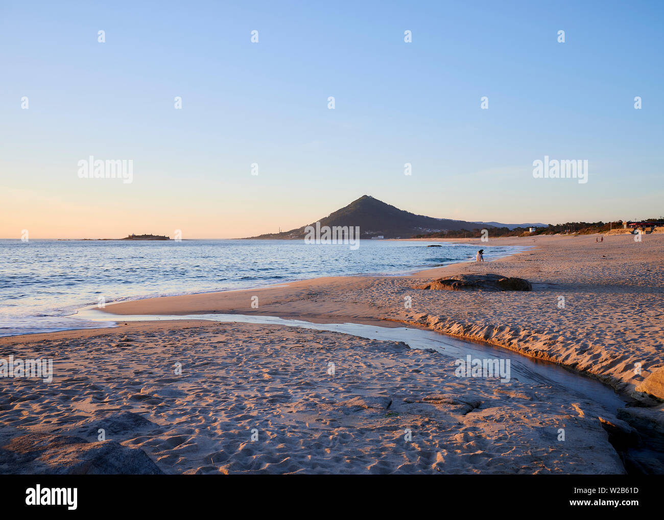 Sunset at the Moledo beach, with a mountain on backgroud Stock Photo ...