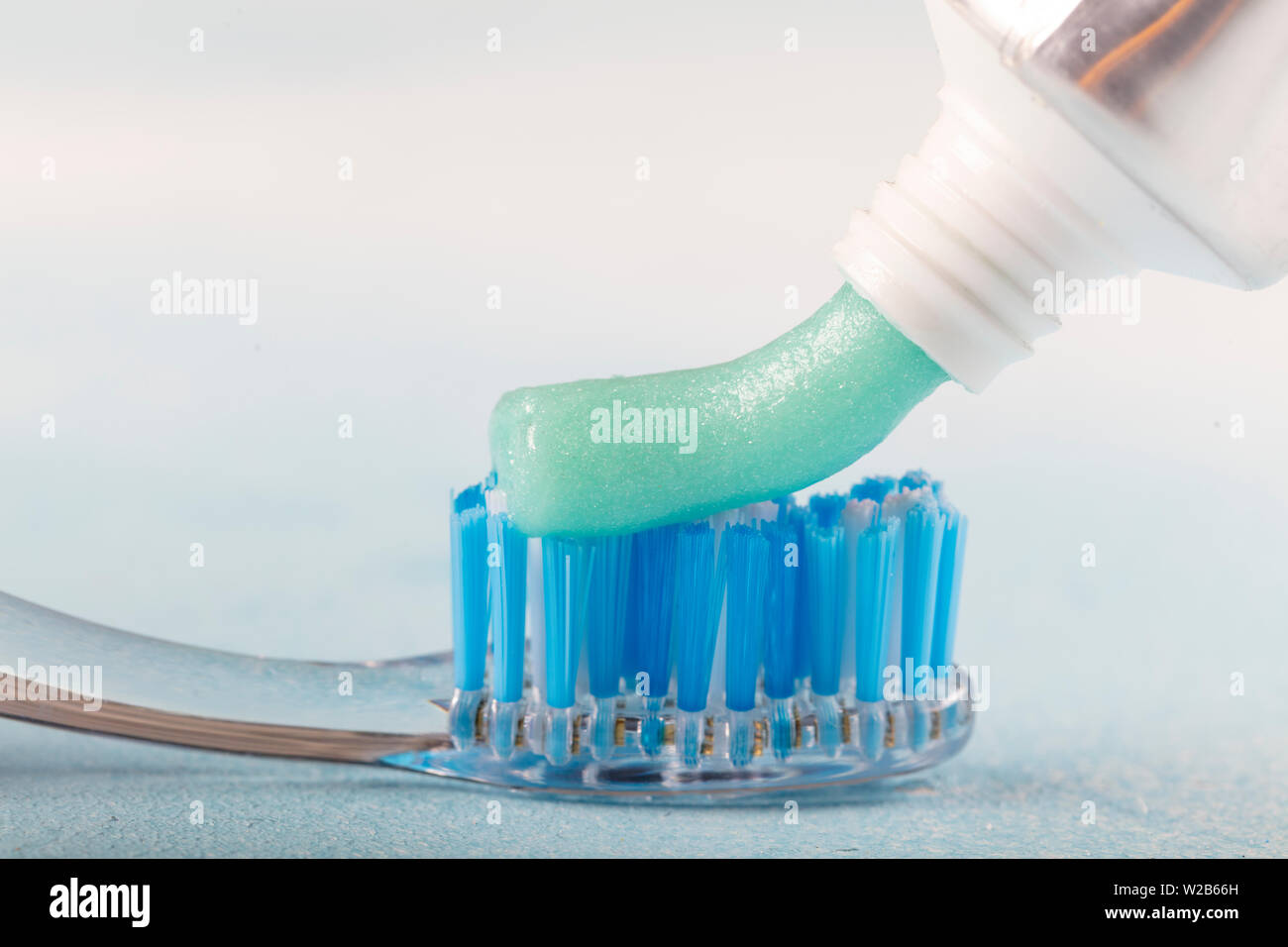 toothbrush on the table with toothpaste and toothpaste tube on blurred ...