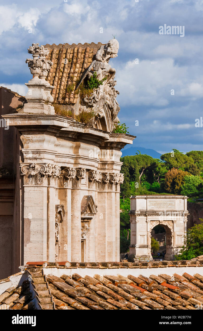 Ancient architecture in Rome. Arch of Titus and baroque church in Roman ...