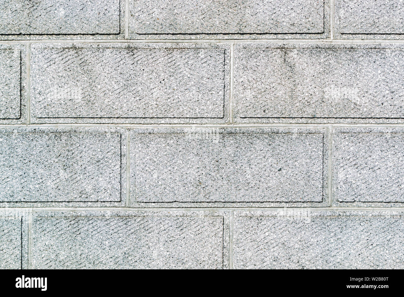 Modern concrete wall texture and brick background Stock Photo - Alamy