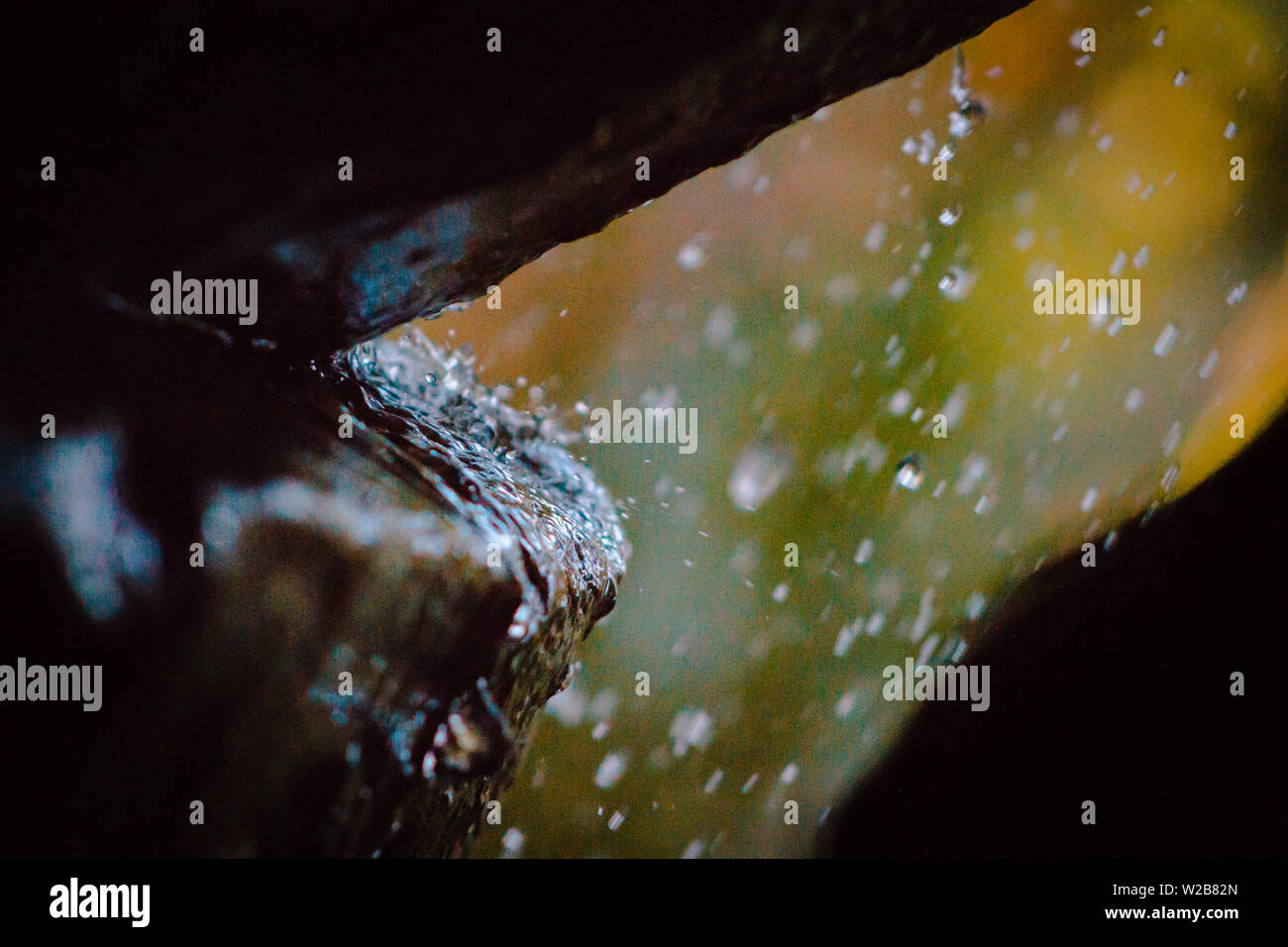 water droplets splashing on a stone Stock Photo - Alamy