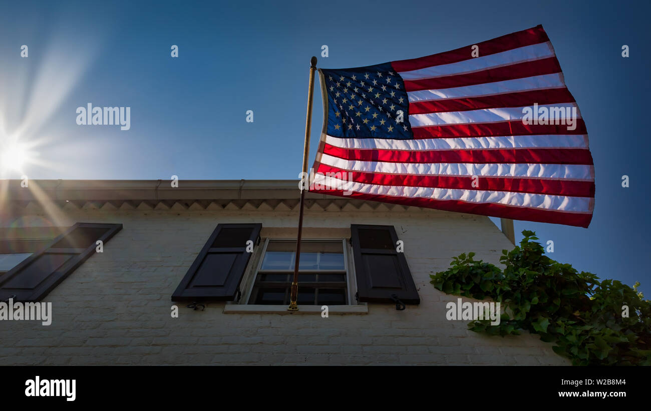 American flag flying above flag hi-res stock photography and images - Alamy