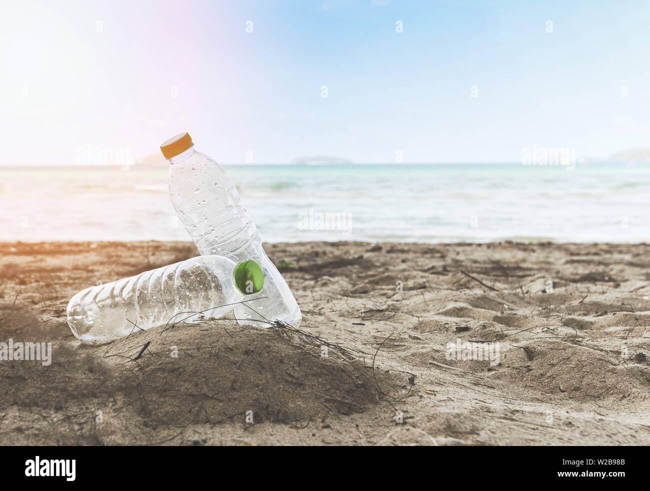 Garbage in the sea with plastic bottle on beach sandy dirty sea on the ...